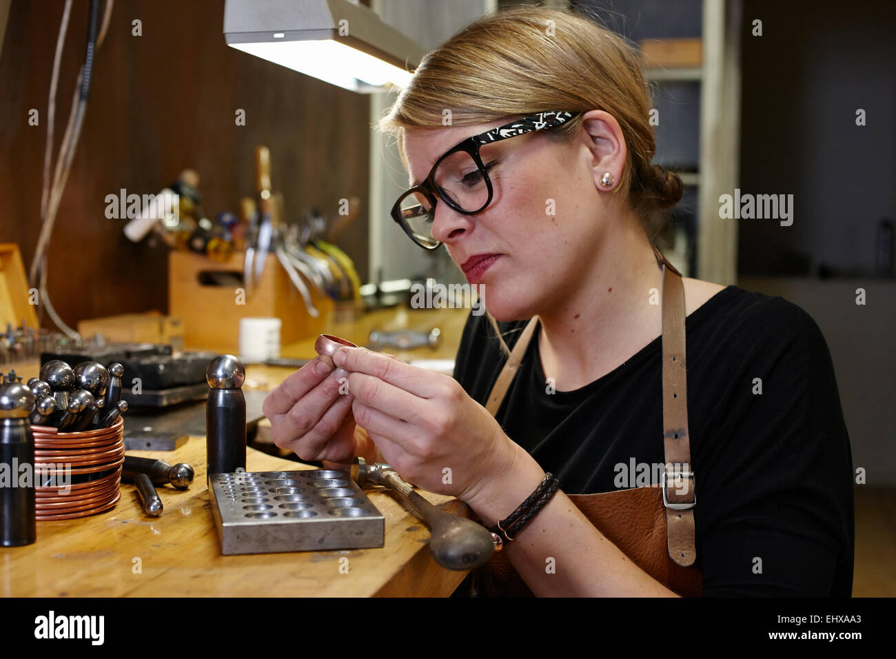 Goldsmith in workshop at work Stock Photo - Alamy