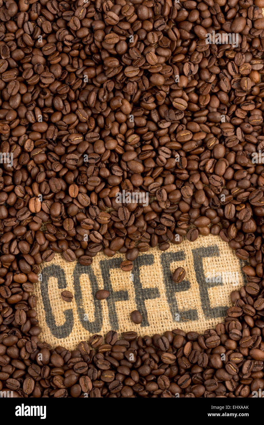 Coffee beans and word 'Coffee' on jute Stock Photo - Alamy