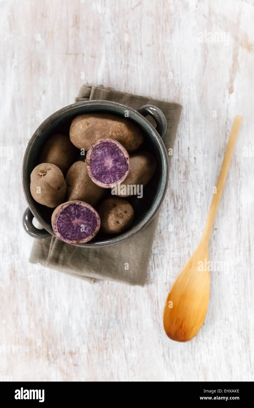 Cooking pot of Blue Congo potatoes Stock Photo - Alamy