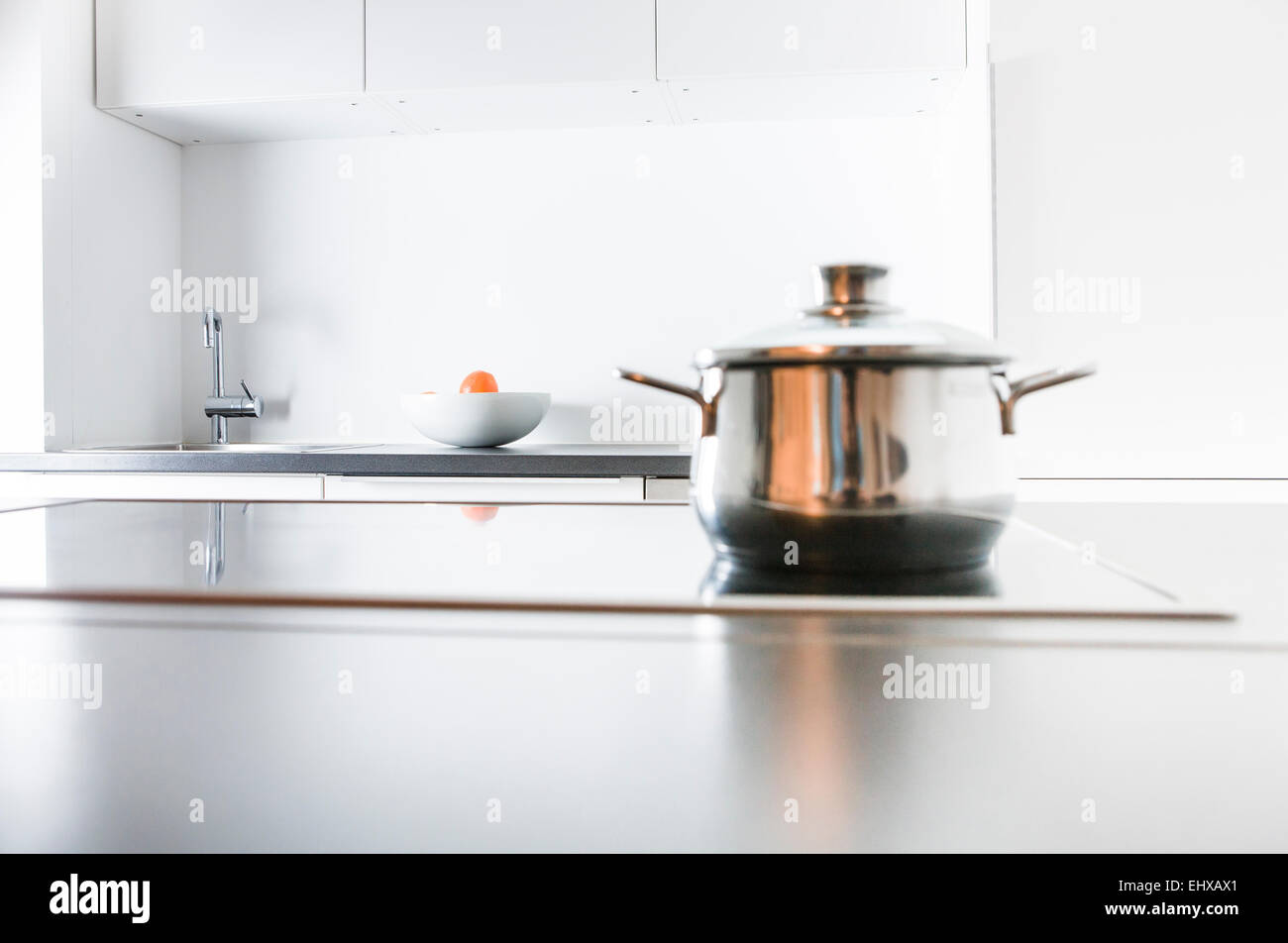 Modern kitchen, pot on cooker Stock Photo - Alamy
