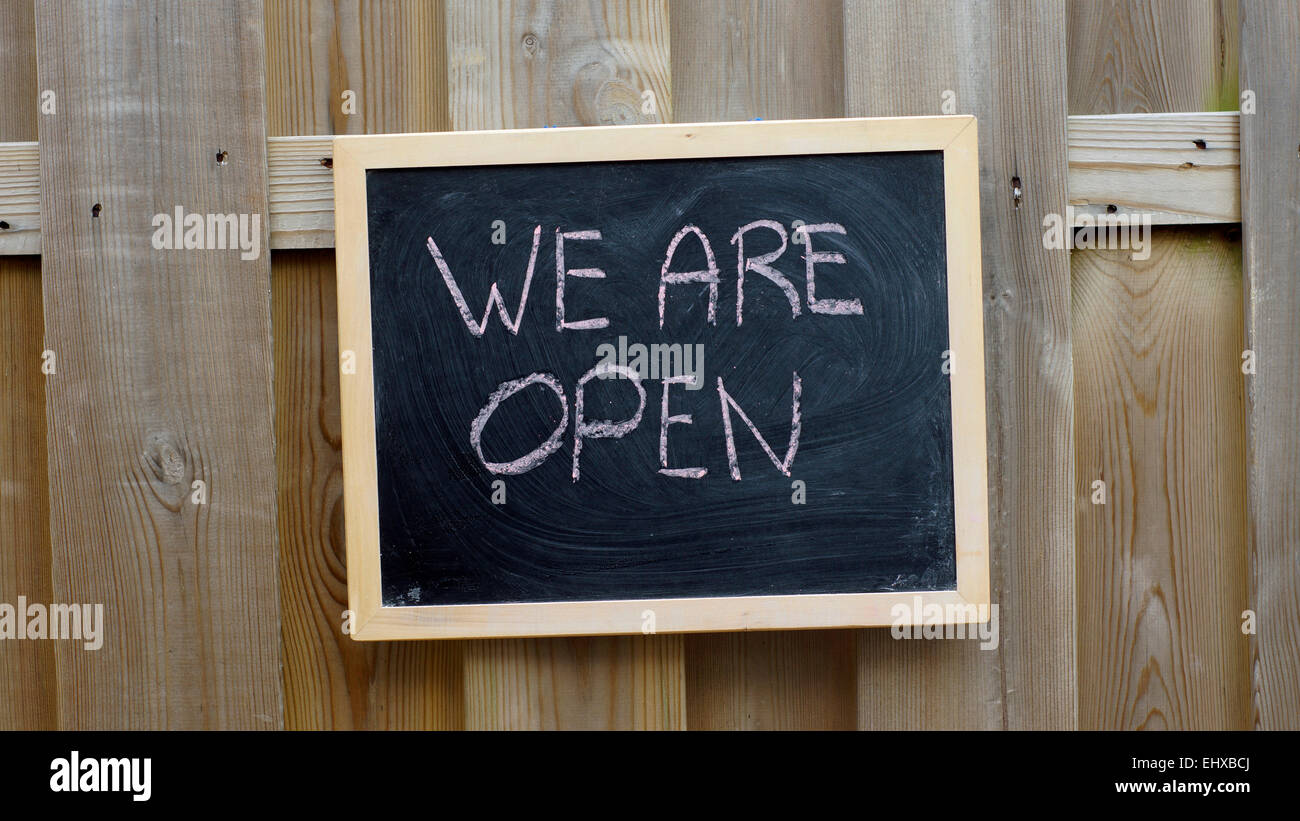 We are open chalkboard sign outside shop hi-res stock photography and ...