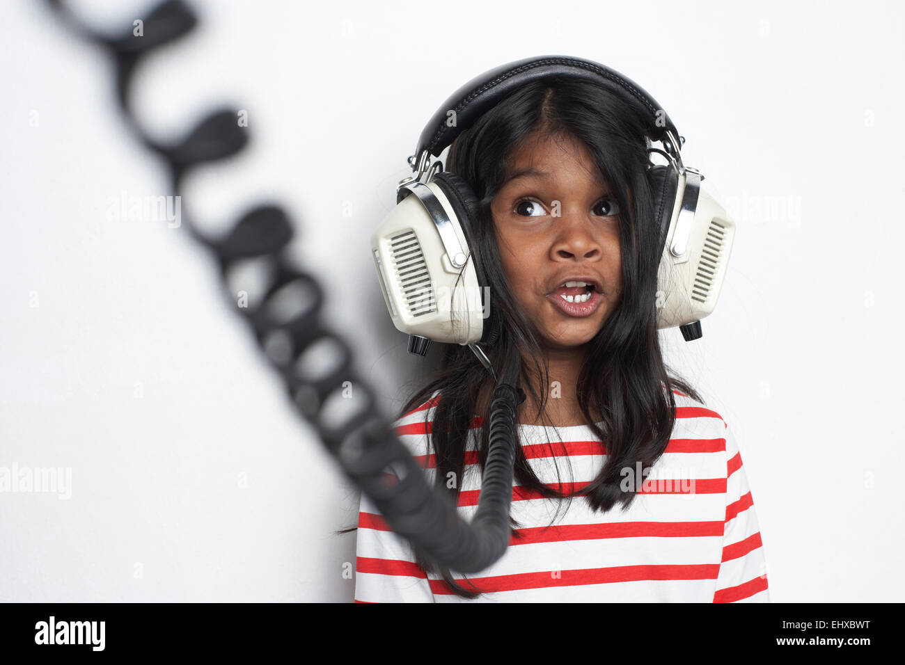 Portrait of girl hearing music with headphones Stock Photo - Alamy