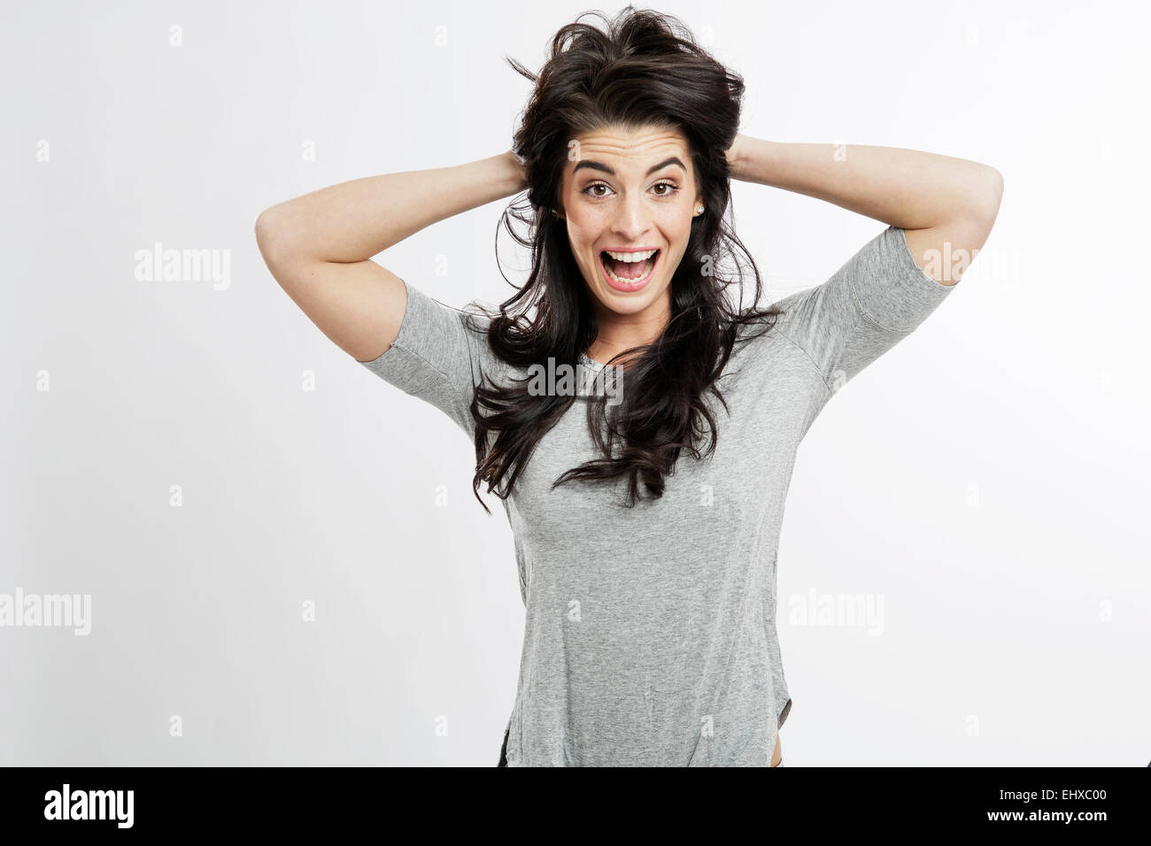 Portrait of excited young woman Stock Photo - Alamy