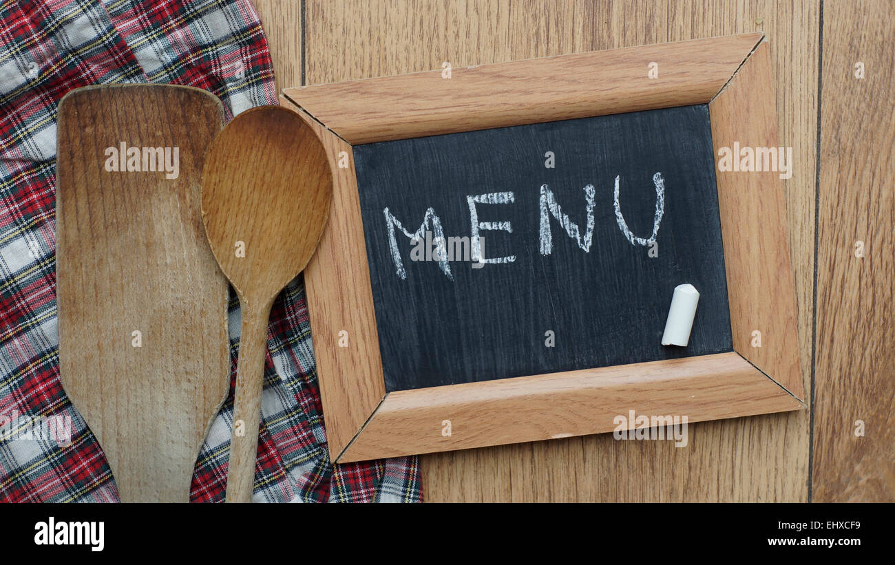 Menu written next to kitchen tools Stock Photo - Alamy