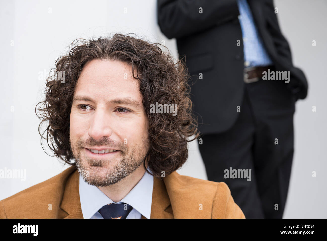 Portrait smiling young businessman suit long hair Stock Photo - Alamy Portrait smiling young businessman suit long hair Stock Photo - Alamy