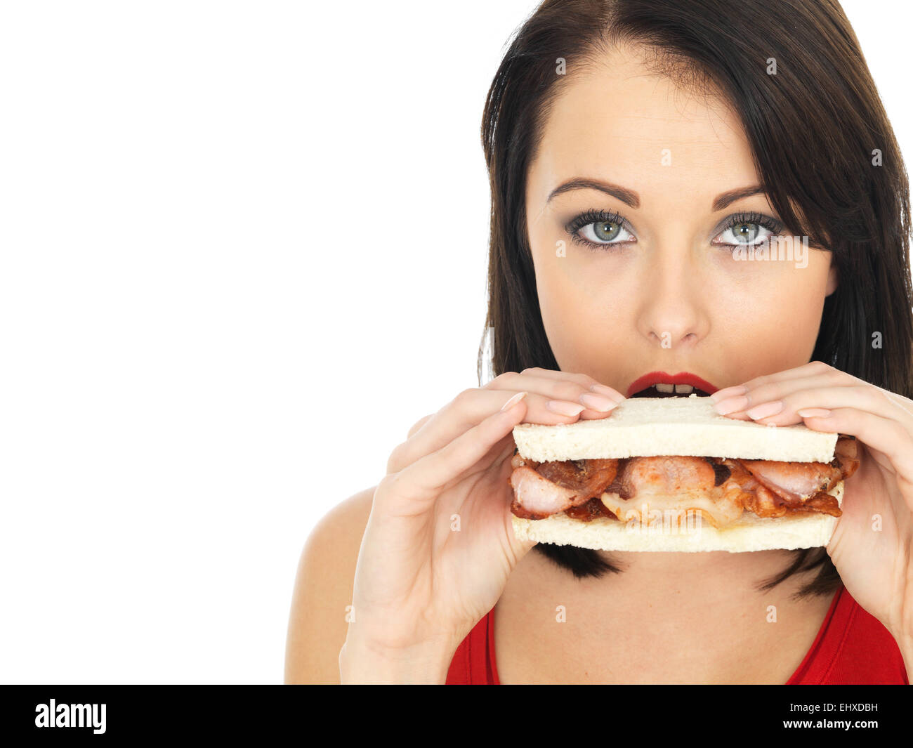 Attractive Young Woman Holding a Bacon Sandwich Stock Photo - Alamy