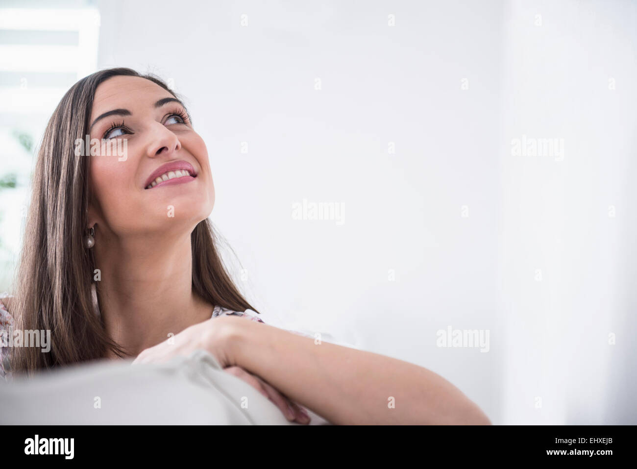 Woman thinking looking up indoors home hi-res stock photography and ...