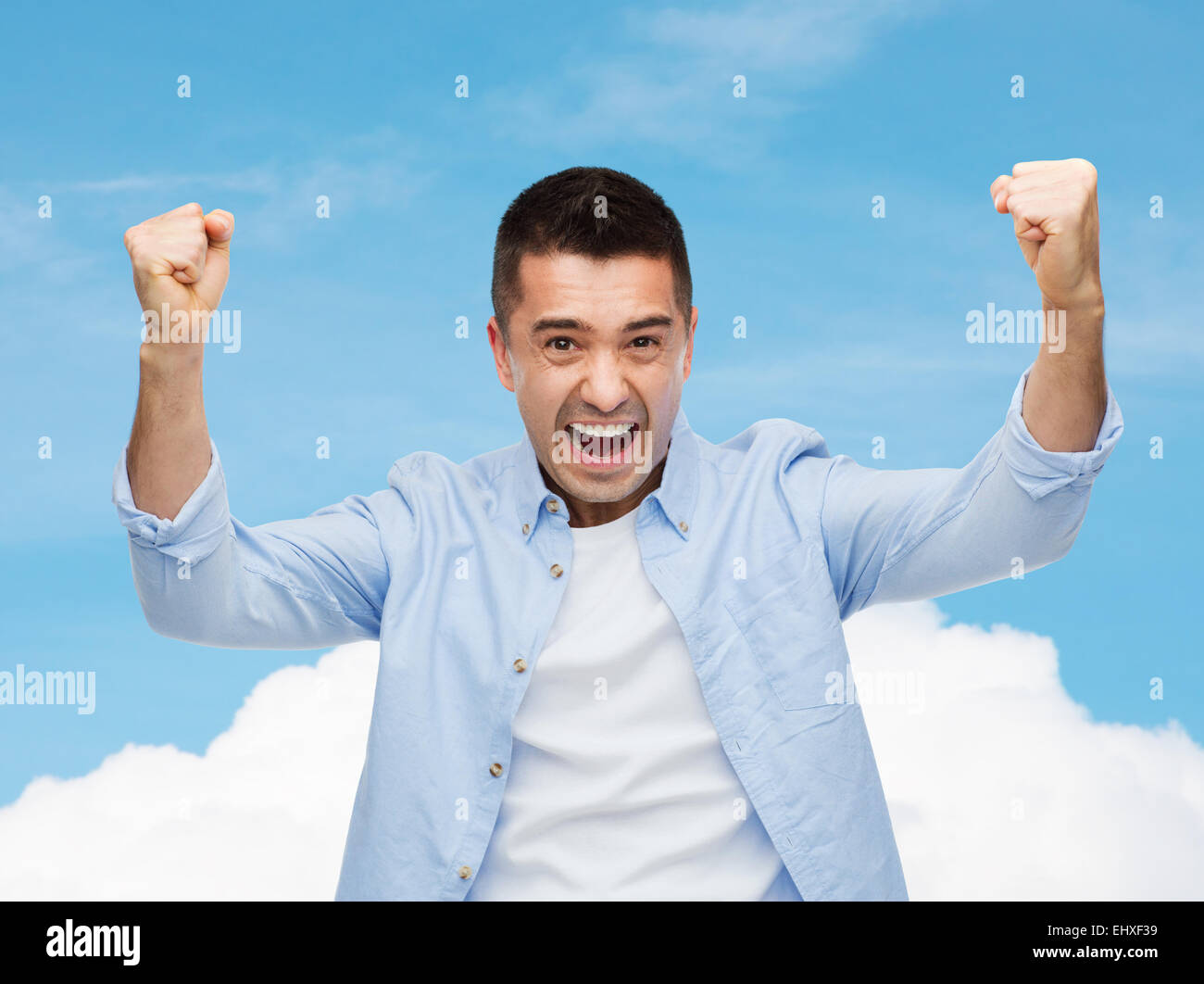 happy laughing man with raised hands Stock Photo - Alamy