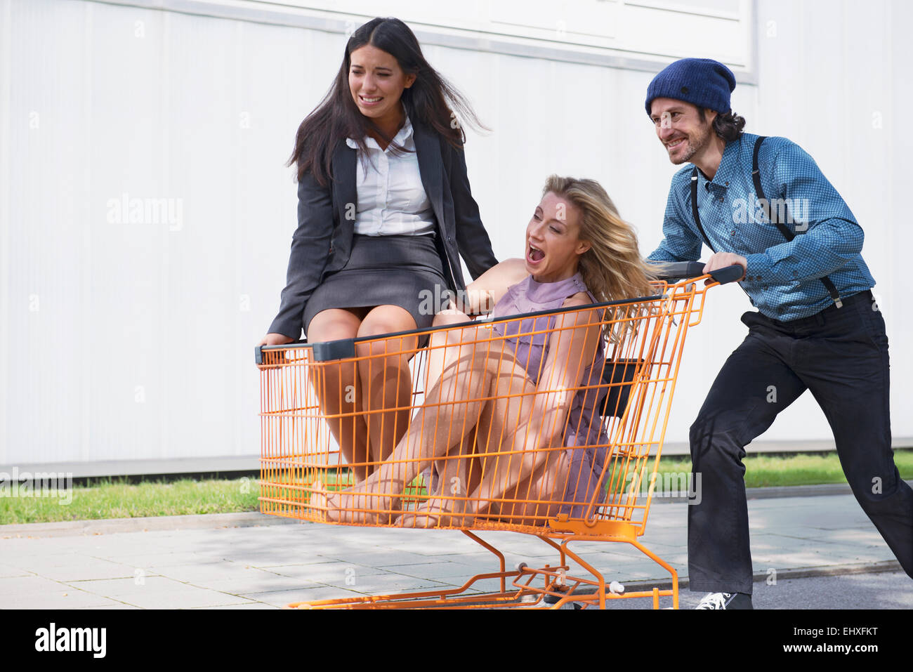 Man pushing trolley hi-res stock photography and images - Alamy