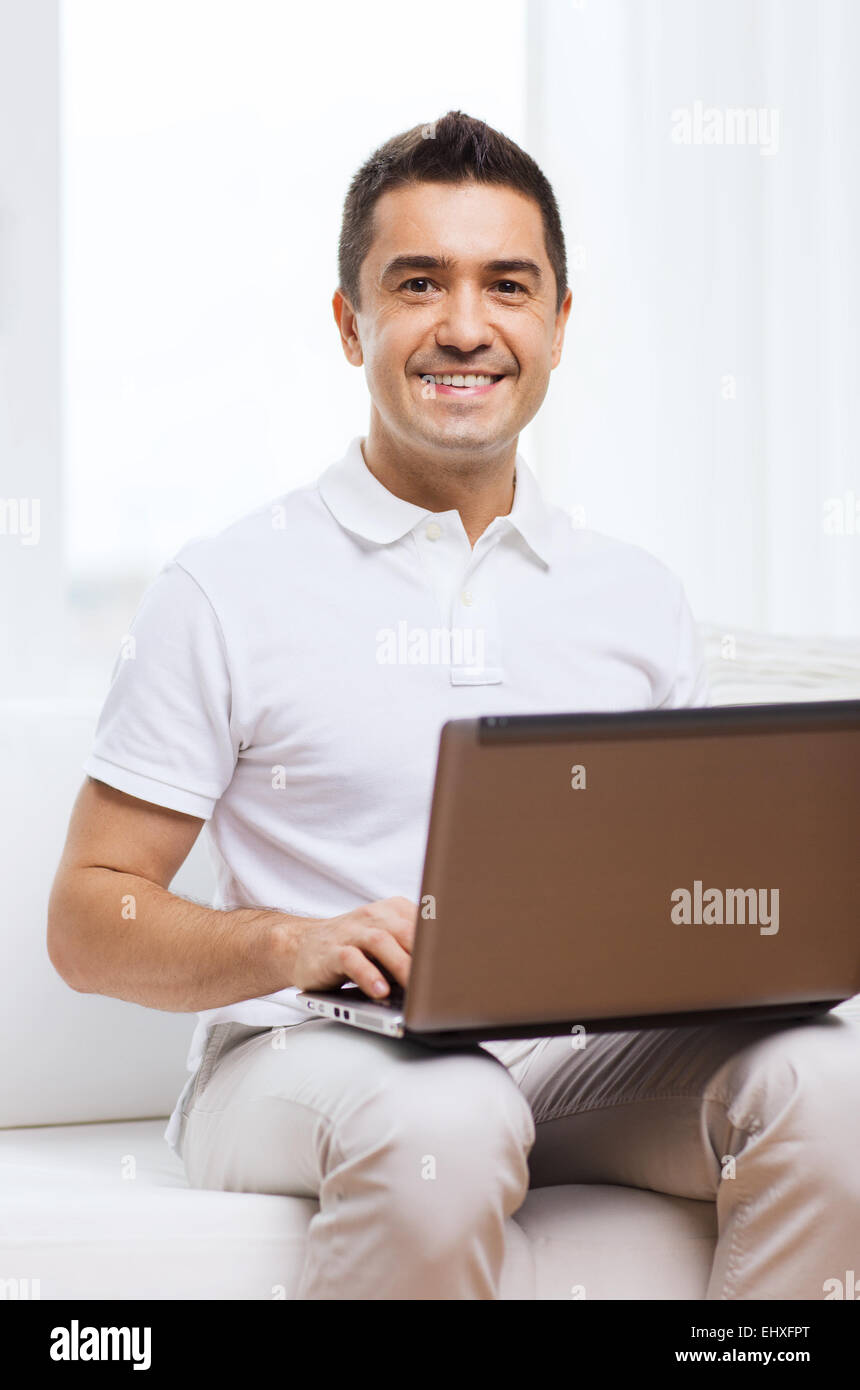 happy man working with laptop computer at home Stock Photo - Alamy