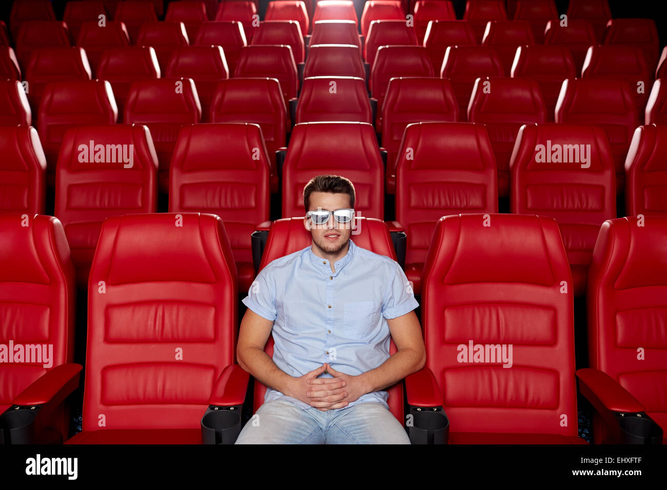Young man cinema watching movie hi-res stock photography and images - Alamy