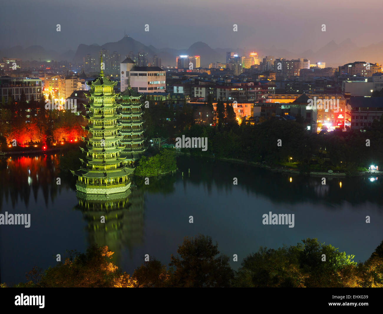 The Sun and Moon pagodas at Banyan lake in Guilin, China Stock Photo ...
