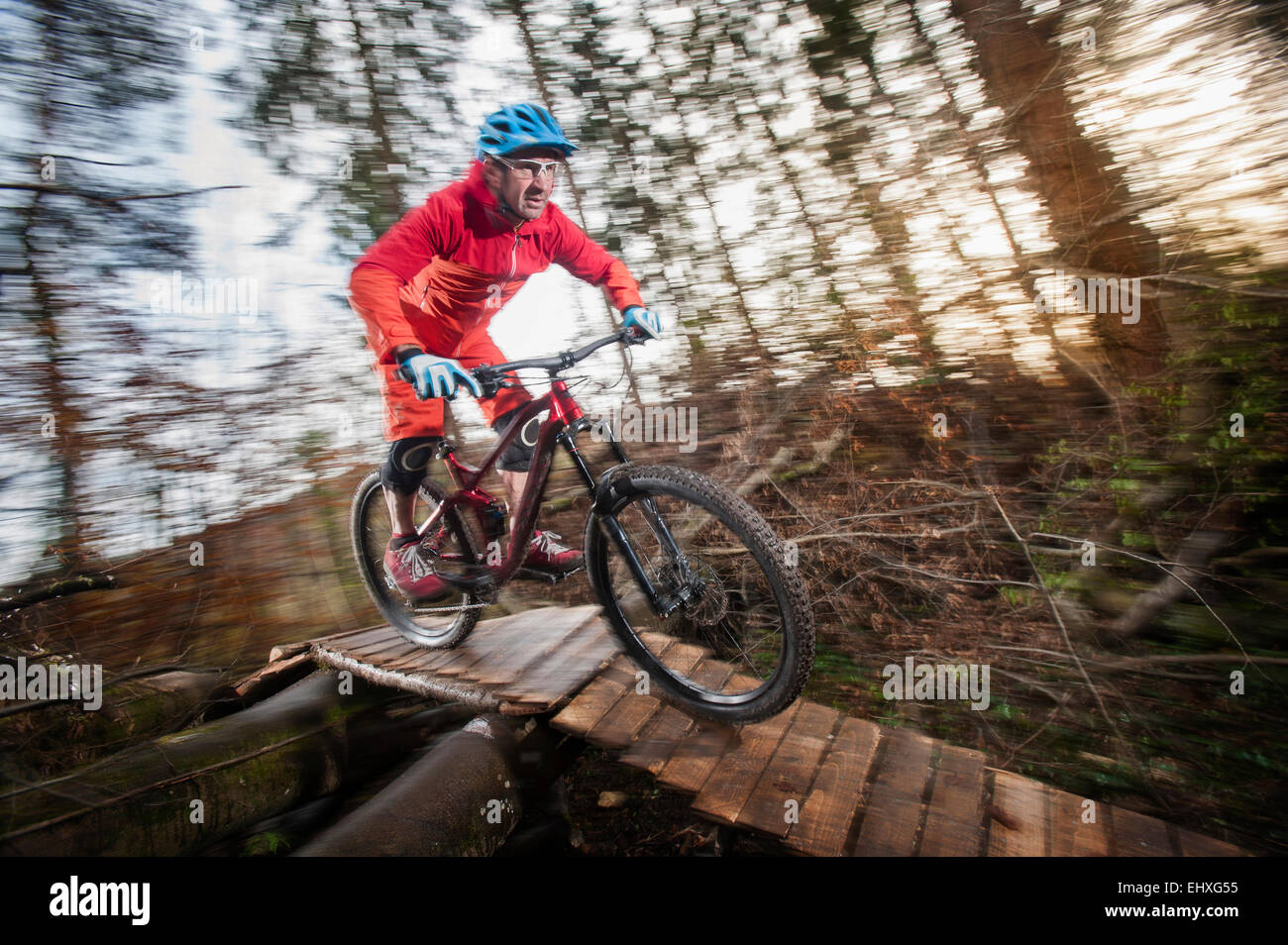 Mountain biker crossing wooden bridge hi-res stock photography and ...