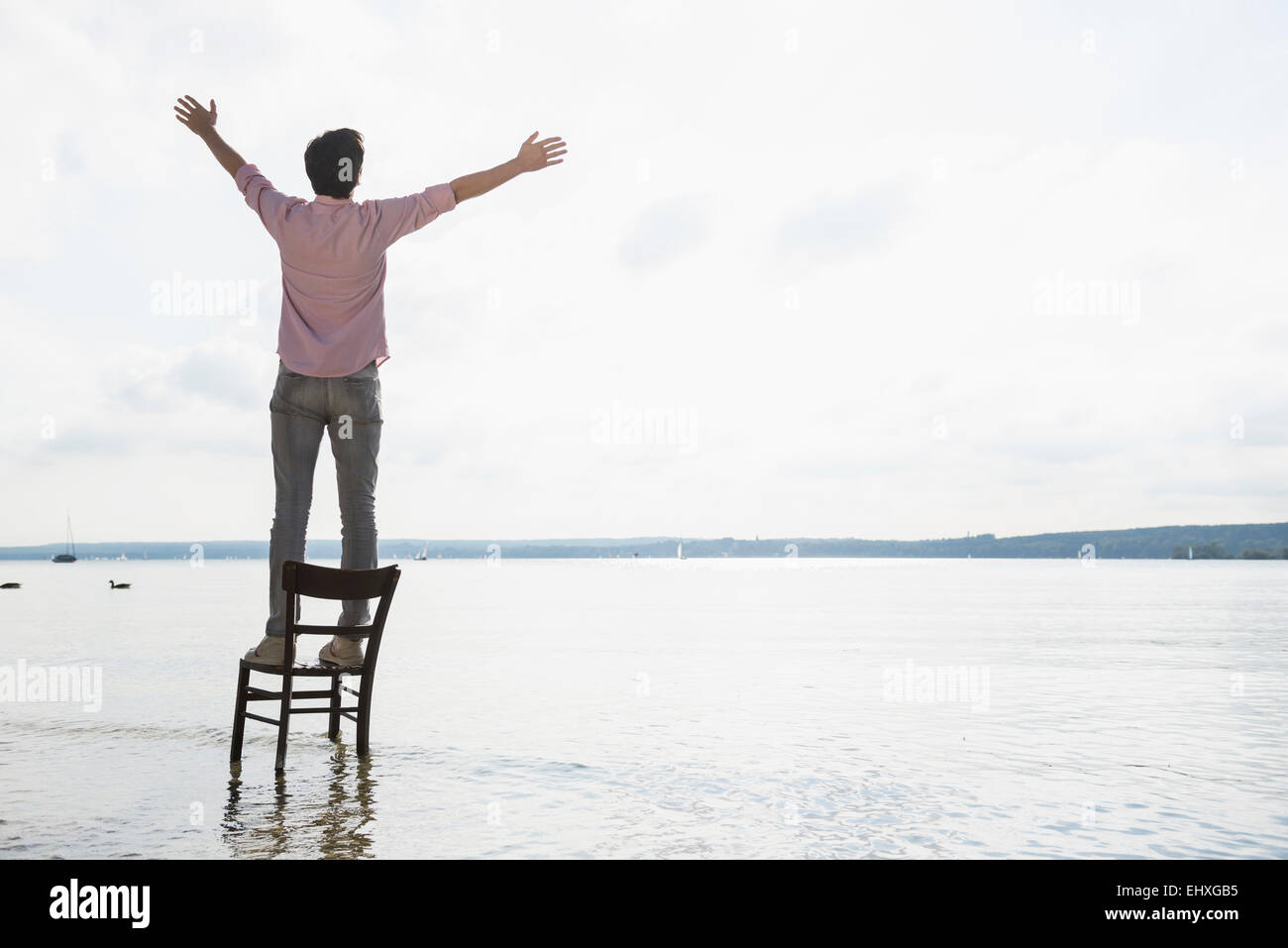 Man Standing Behind Chair High Resolution Stock Photography and Images ...