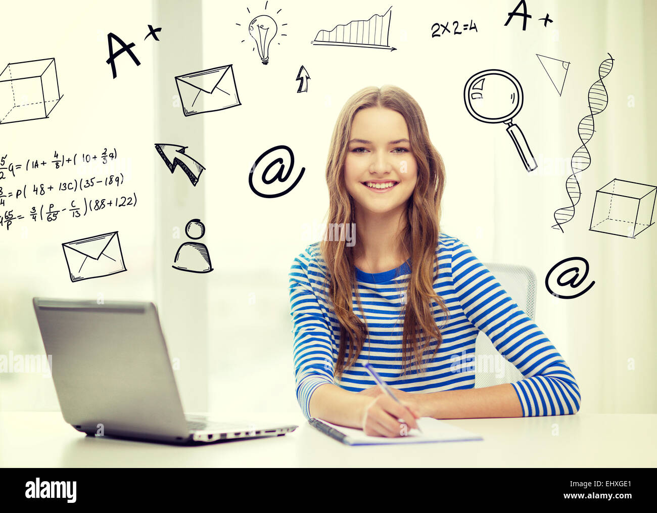 smiling teenage girl laptop computer and notebook Stock Photo - Alamy