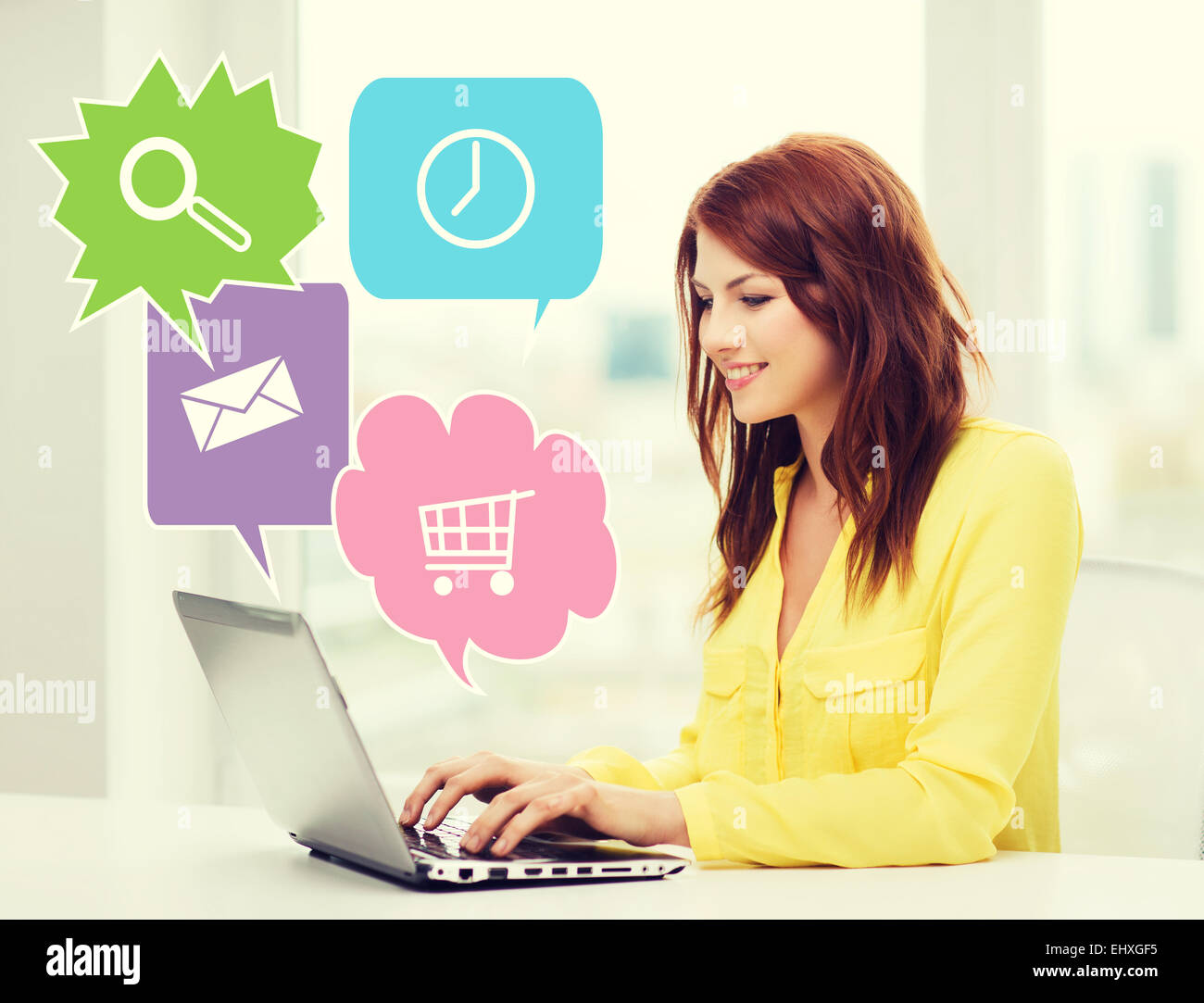 smiling woman with laptop computer at home Stock Photo - Alamy
