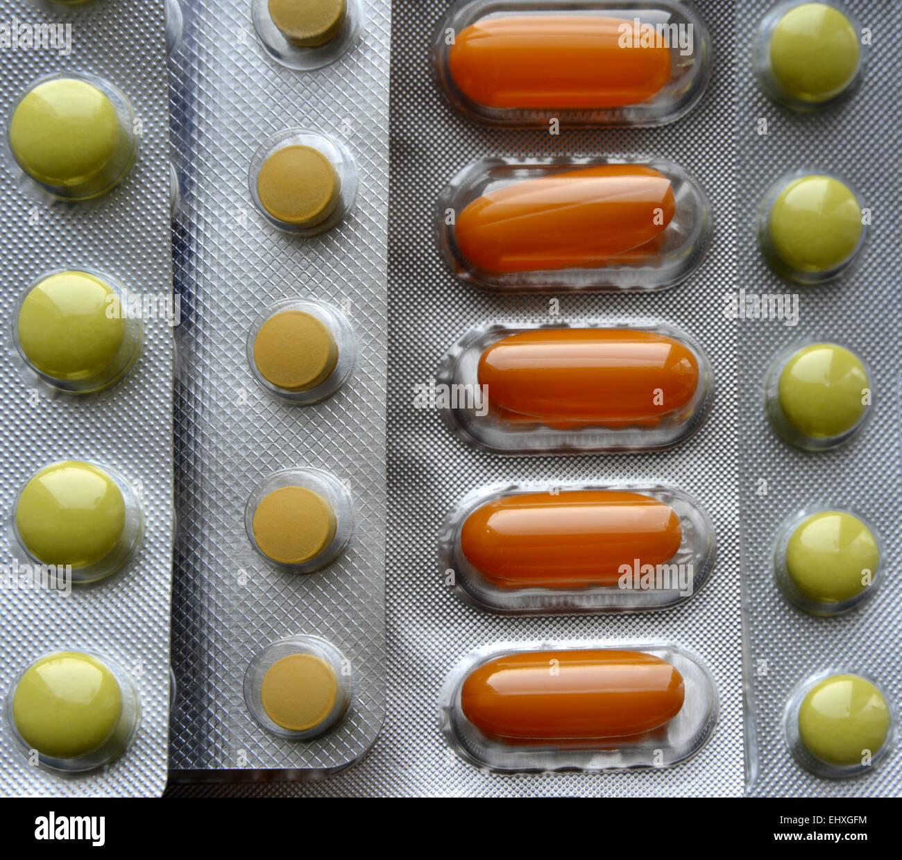 This is a close-up of pills in its package. Medicaments are yellow and ...
