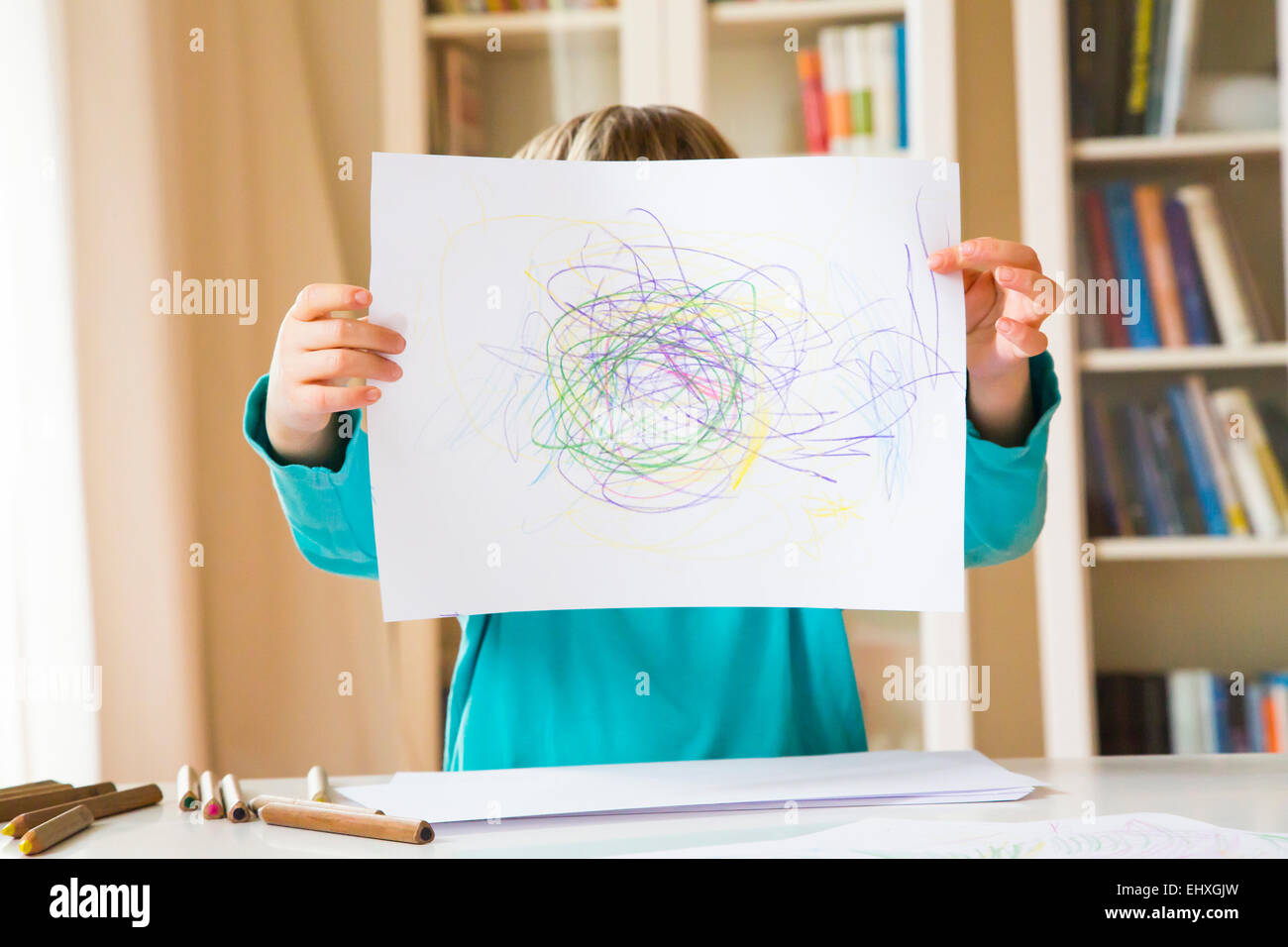 Little girl showing drawing Stock Photo - Alamy