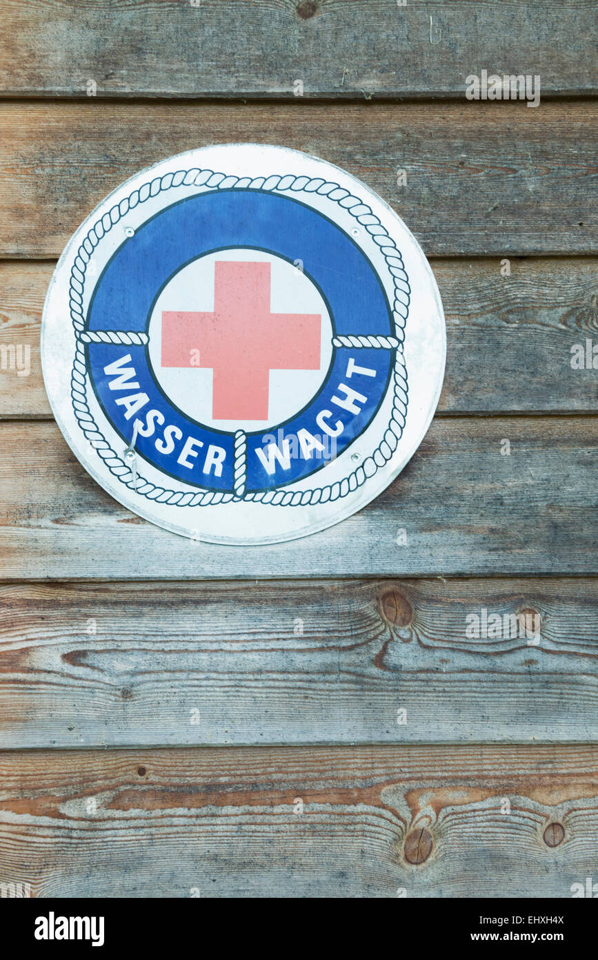 Lifeguard sign hanging wooden shed Stock Photo - Alamy