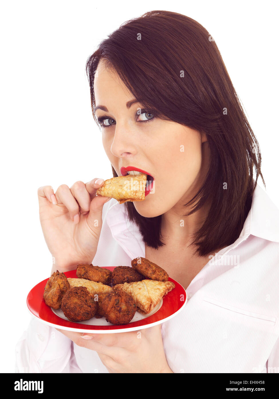 Attractive Young Woman Eating Indian Snack Food Stock Photo - Alamy