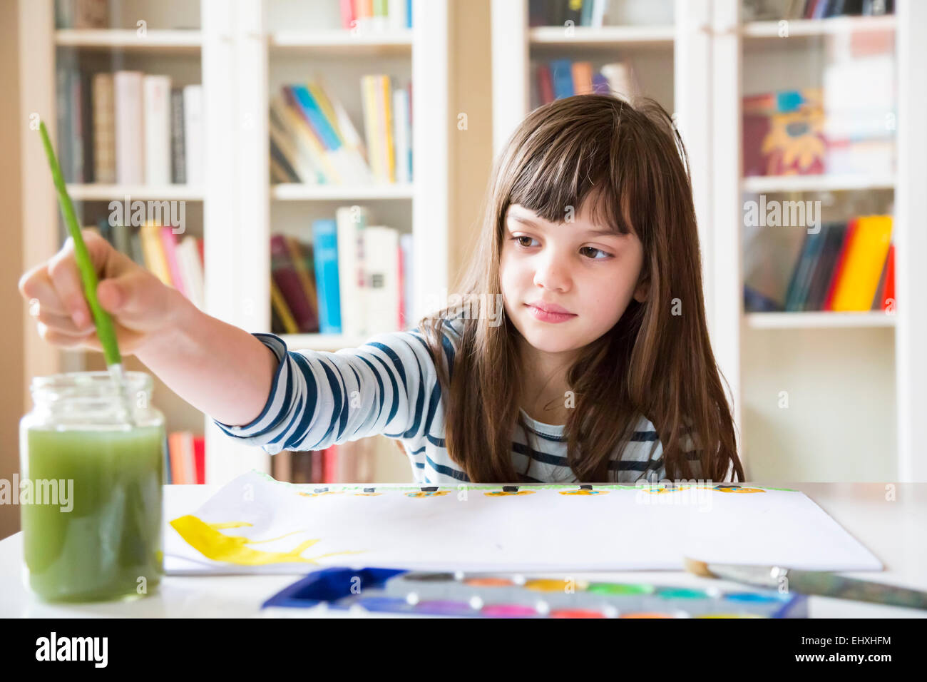 Girl painting with watercolours Stock Photo - Alamy