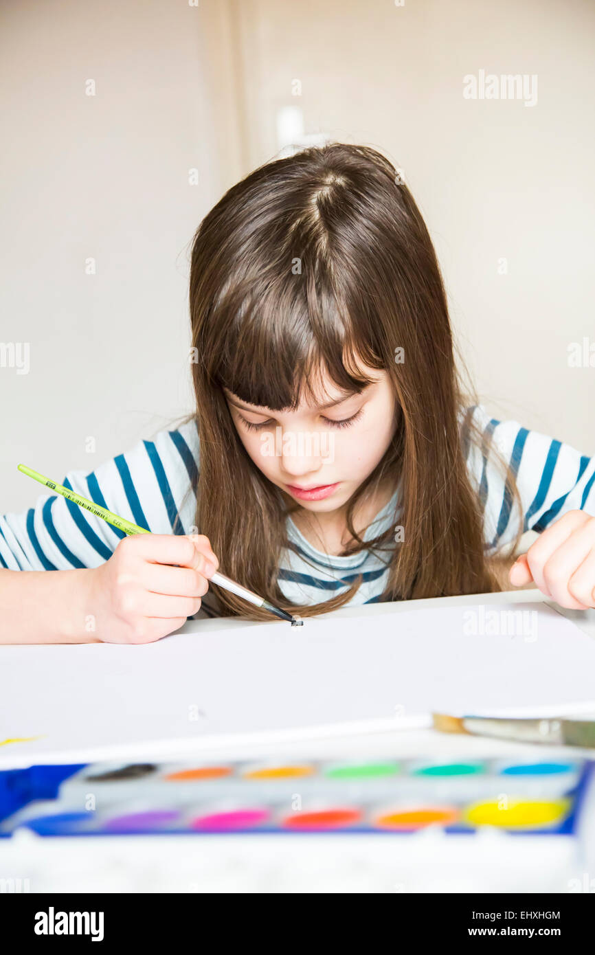 Girl painting with watercolours Stock Photo - Alamy