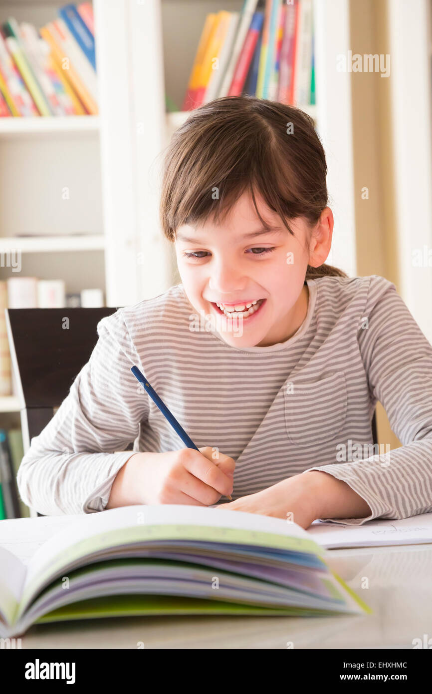 Portrait of smiling girl drawing something Stock Photo - Alamy