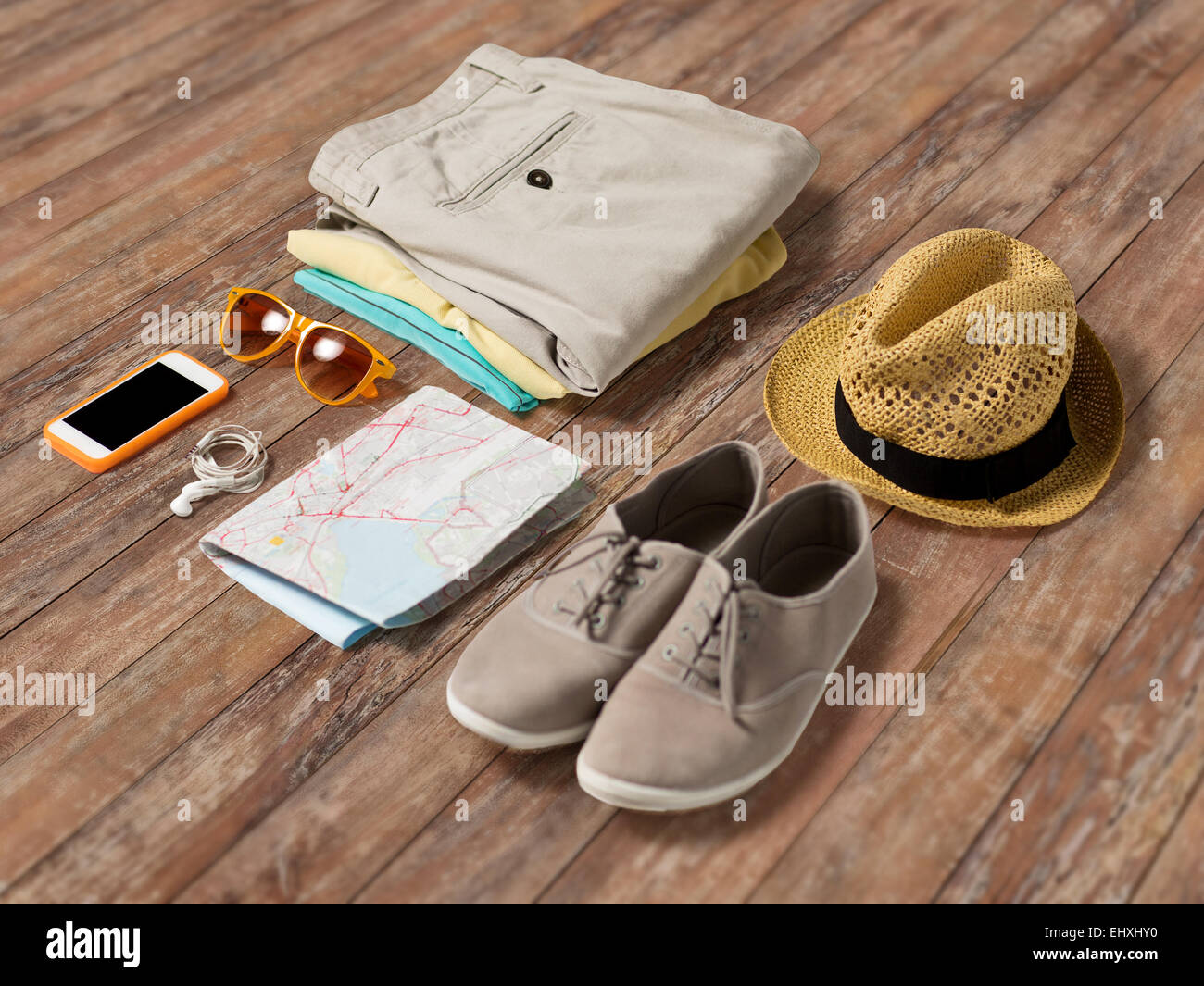 close up of summer clothes and travel map on table Stock Photo - Alamy
