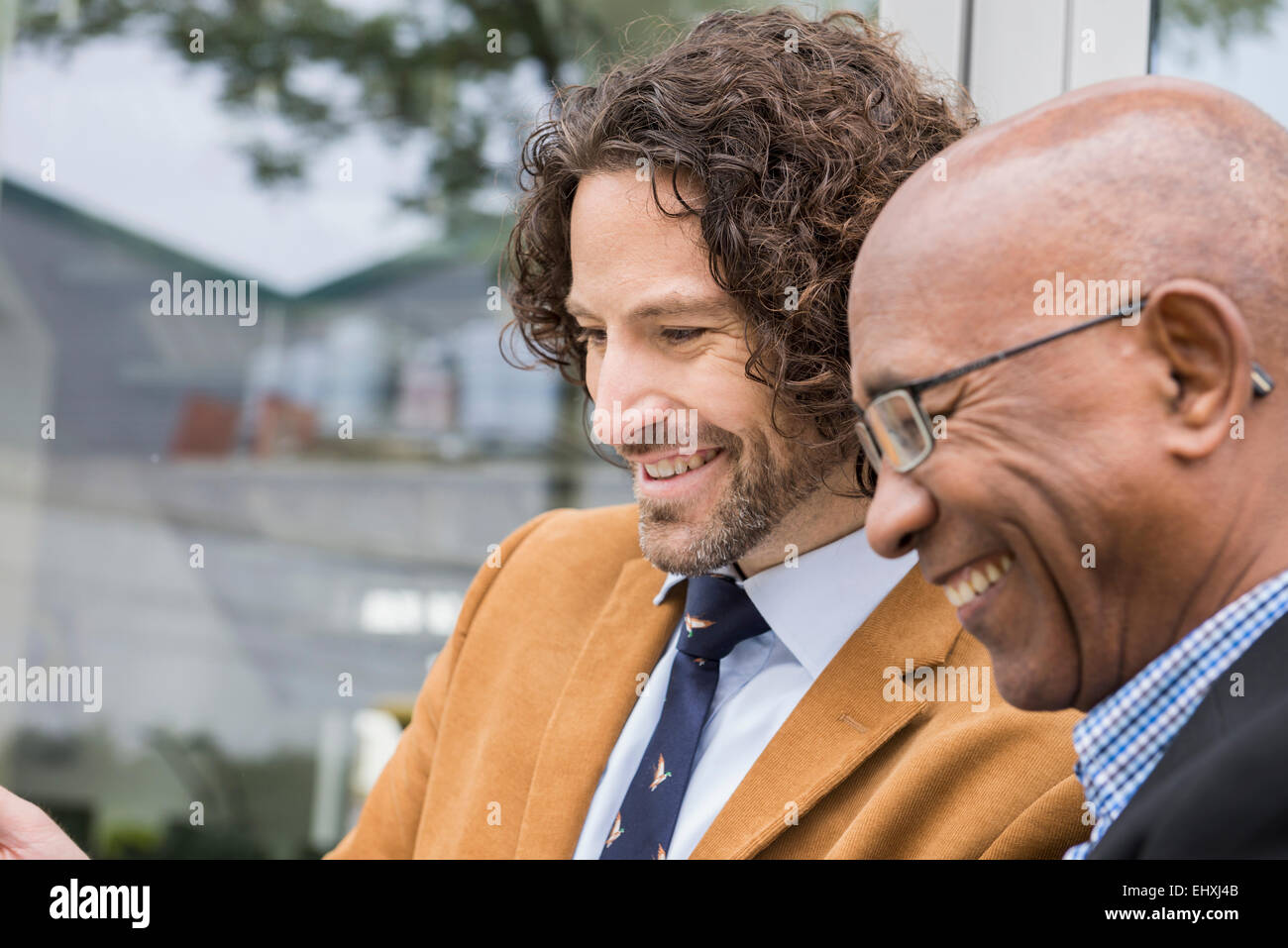 Portrait close up two men talking businessmen Stock Photo - Alamy