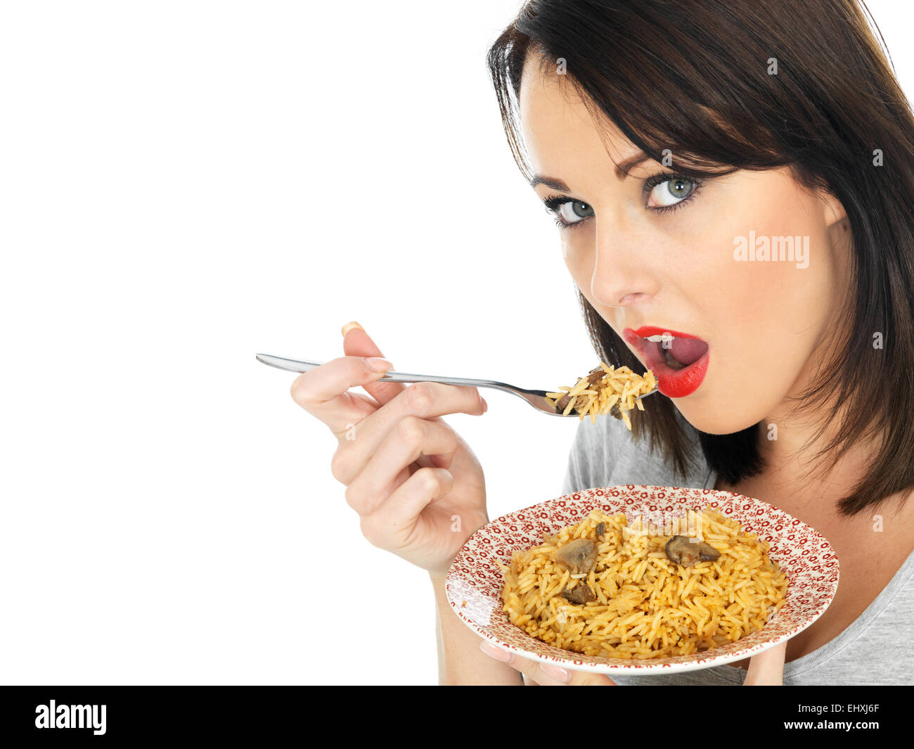 Attractive Young Woman Eating Mushroom Rice Stock Photo - Alamy