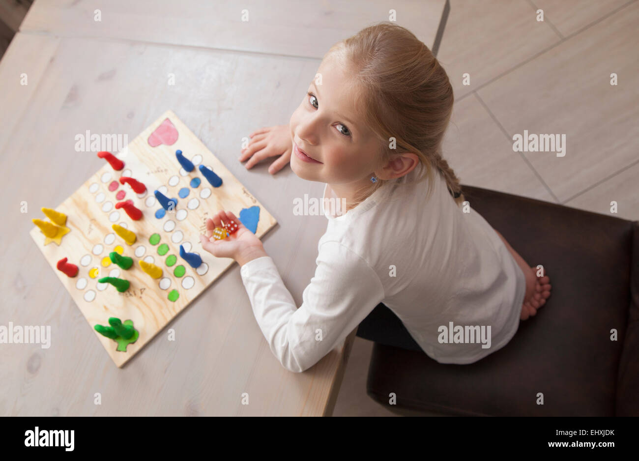 Girl playing board game hi-res stock photography and images - Alamy