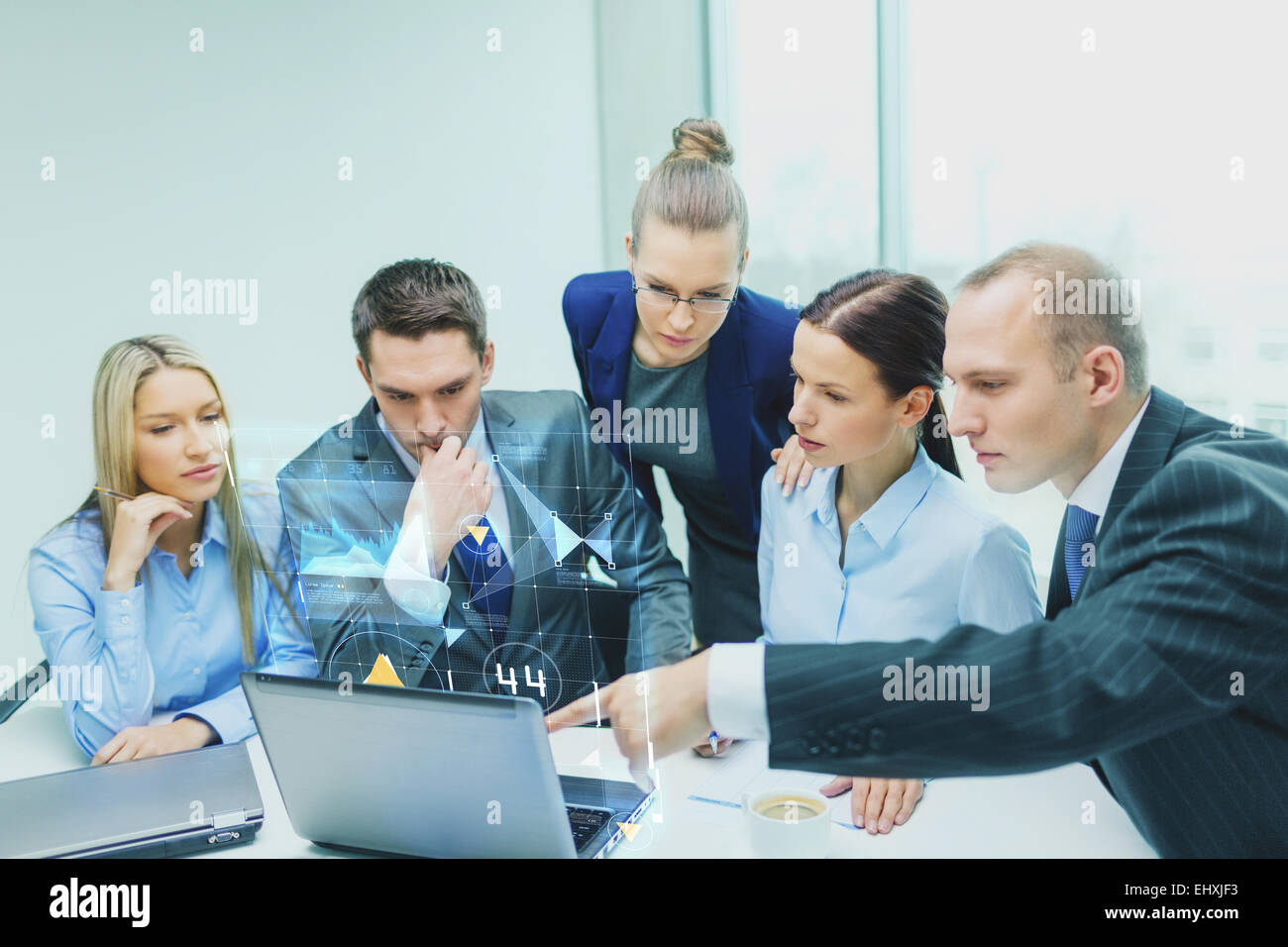 business team with laptop having discussion Stock Photo - Alamy