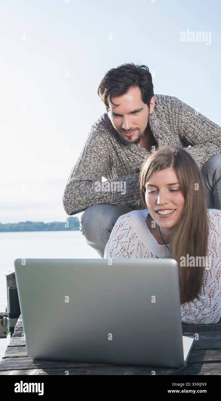 Couple outdoors working computer laptop Stock Photo - Alamy