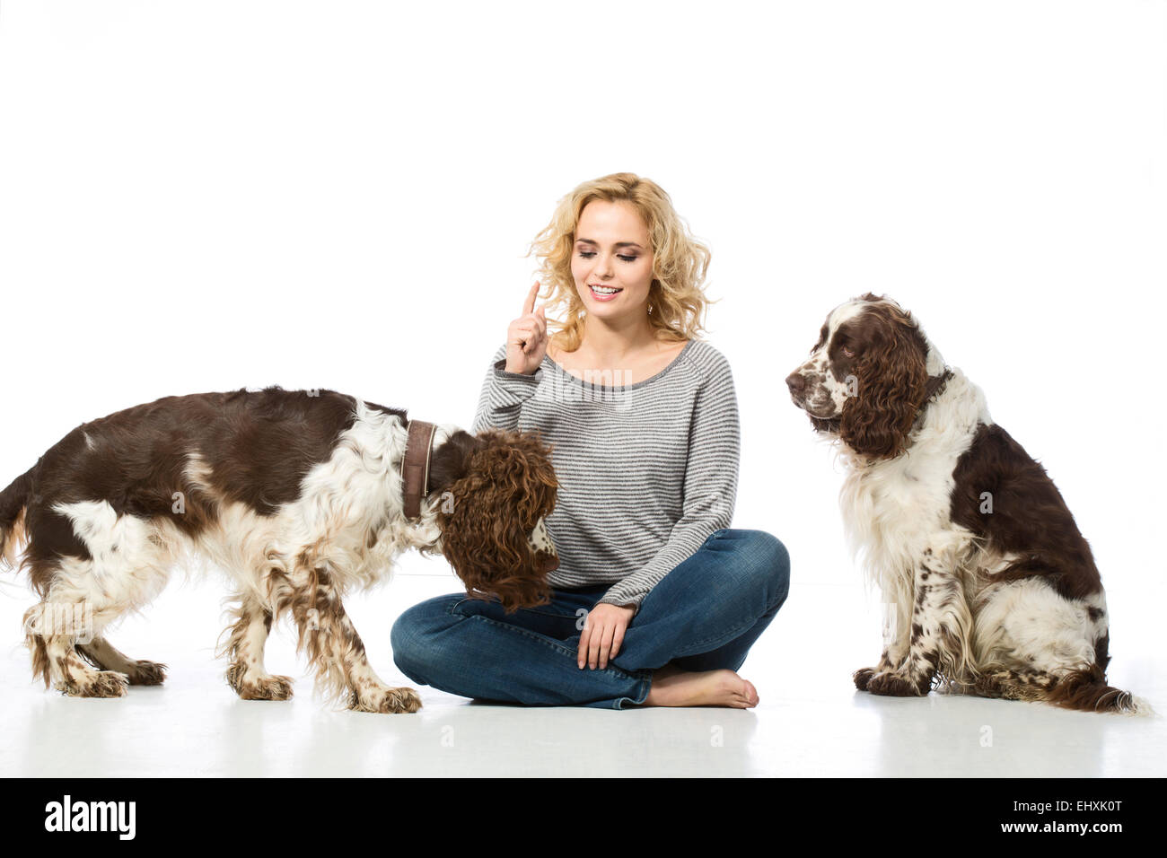 Young woman with two dogs Stock Photo - Alamy