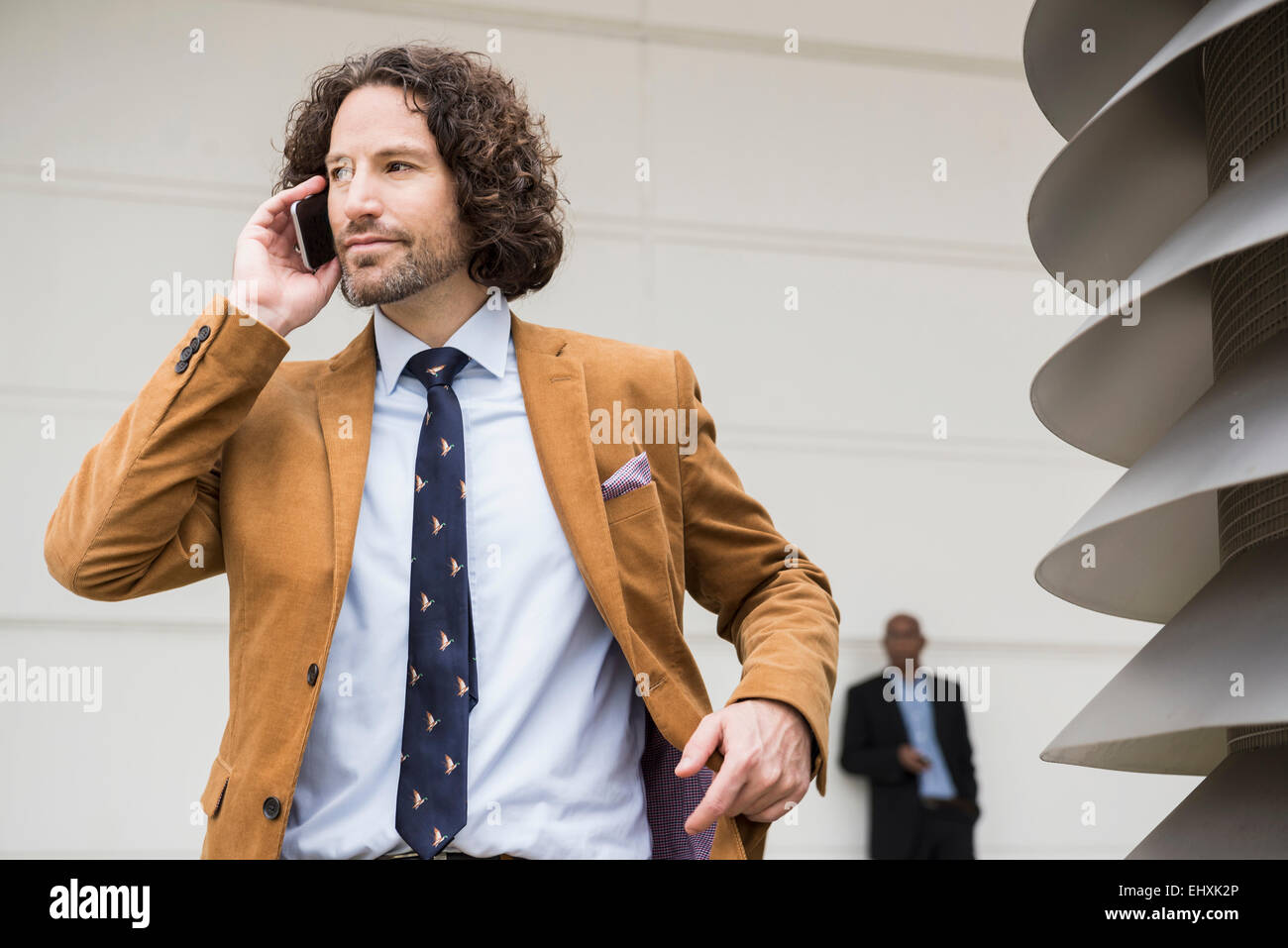 businessman suit brown cell phone talking Stock Photo - Alamy