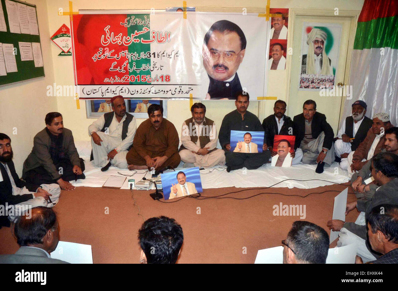 Activists of Muttahida Qaumi Movement listen telephonic speech of MQM ...