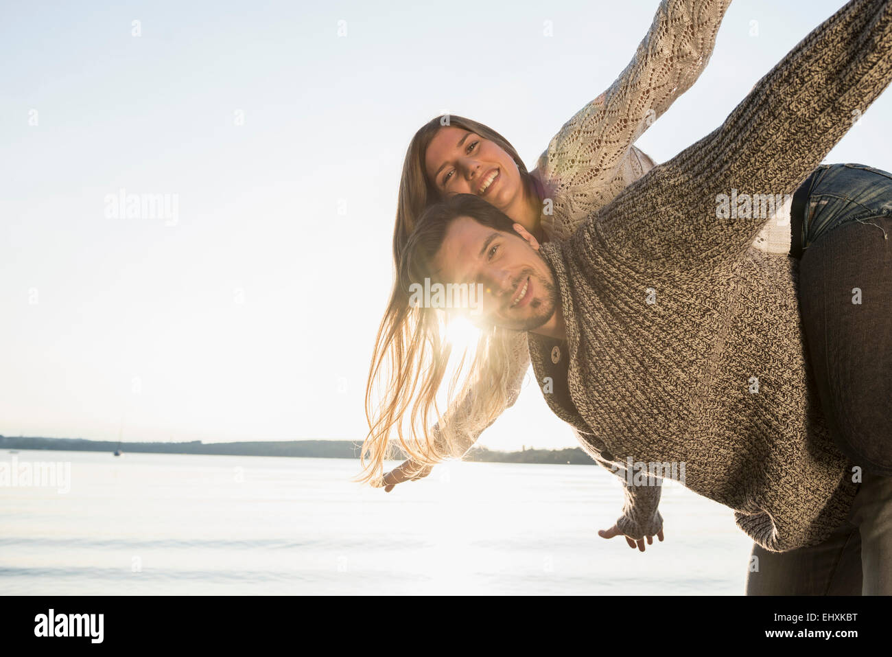 Woman riding piggyback on back hi-res stock photography and images - Alamy