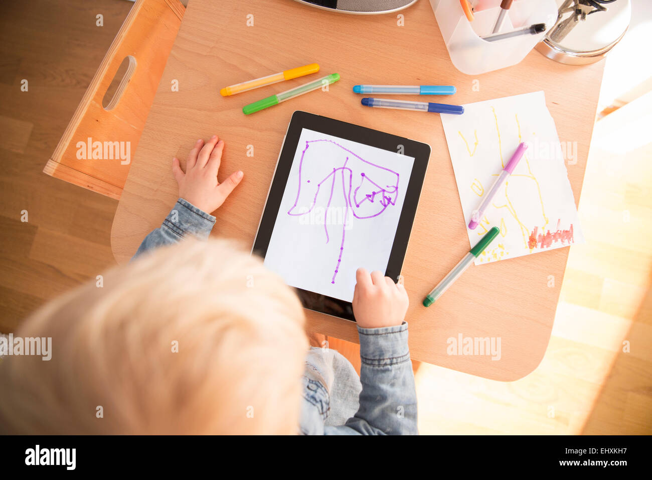 Little boy drawing with digital tablet Stock Photo - Alamy