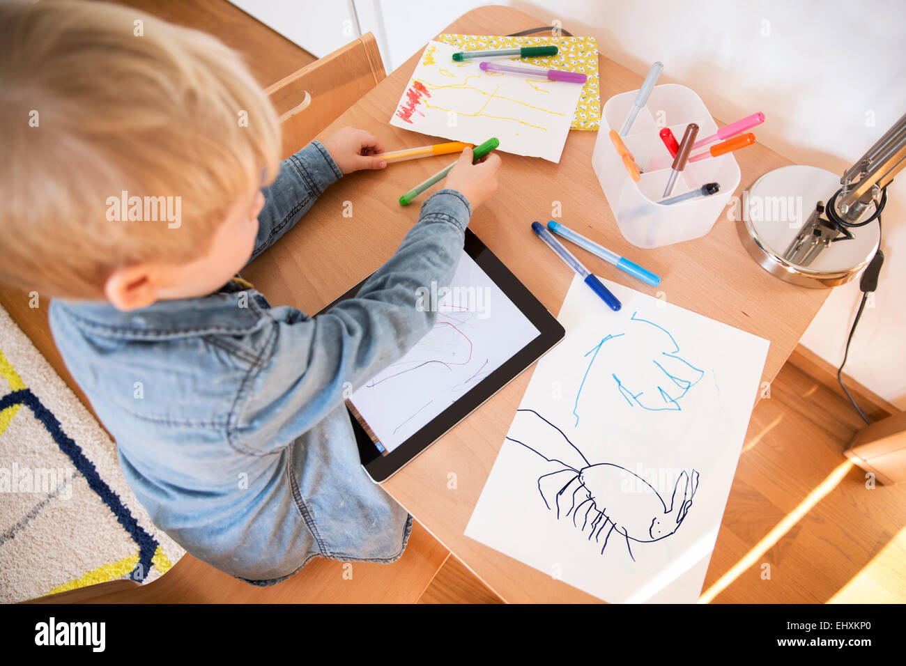 Little boy drawing with digital tablet Stock Photo - Alamy