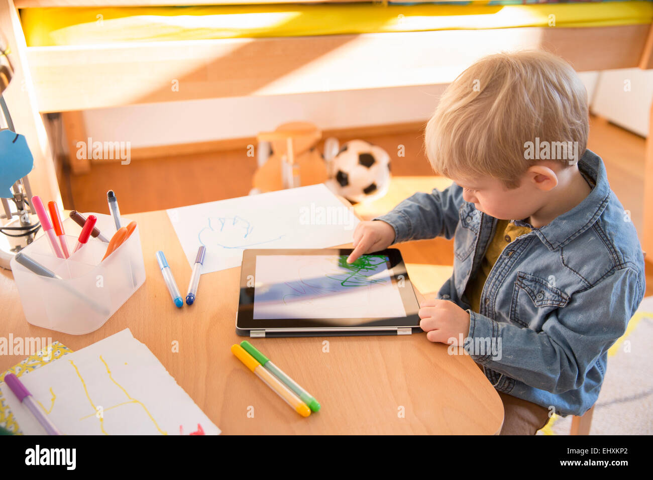 Little boy drawing with digital tablet Stock Photo - Alamy