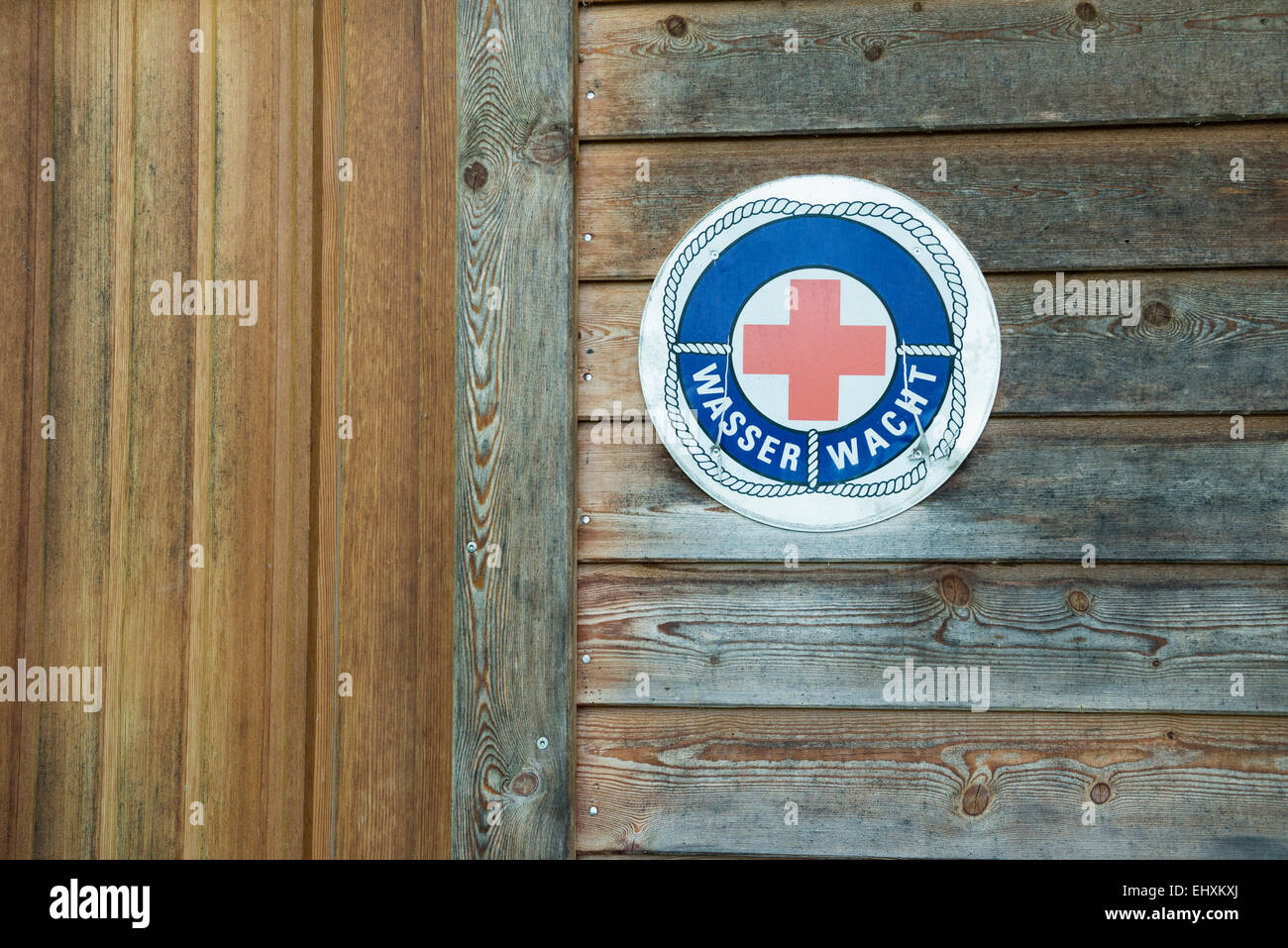 Lifeguard sign hanging wooden shed Stock Photo - Alamy