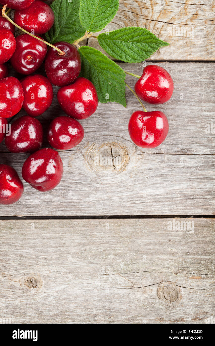 Ripe cherries on wooden table with copy space Stock Photo - Alamy