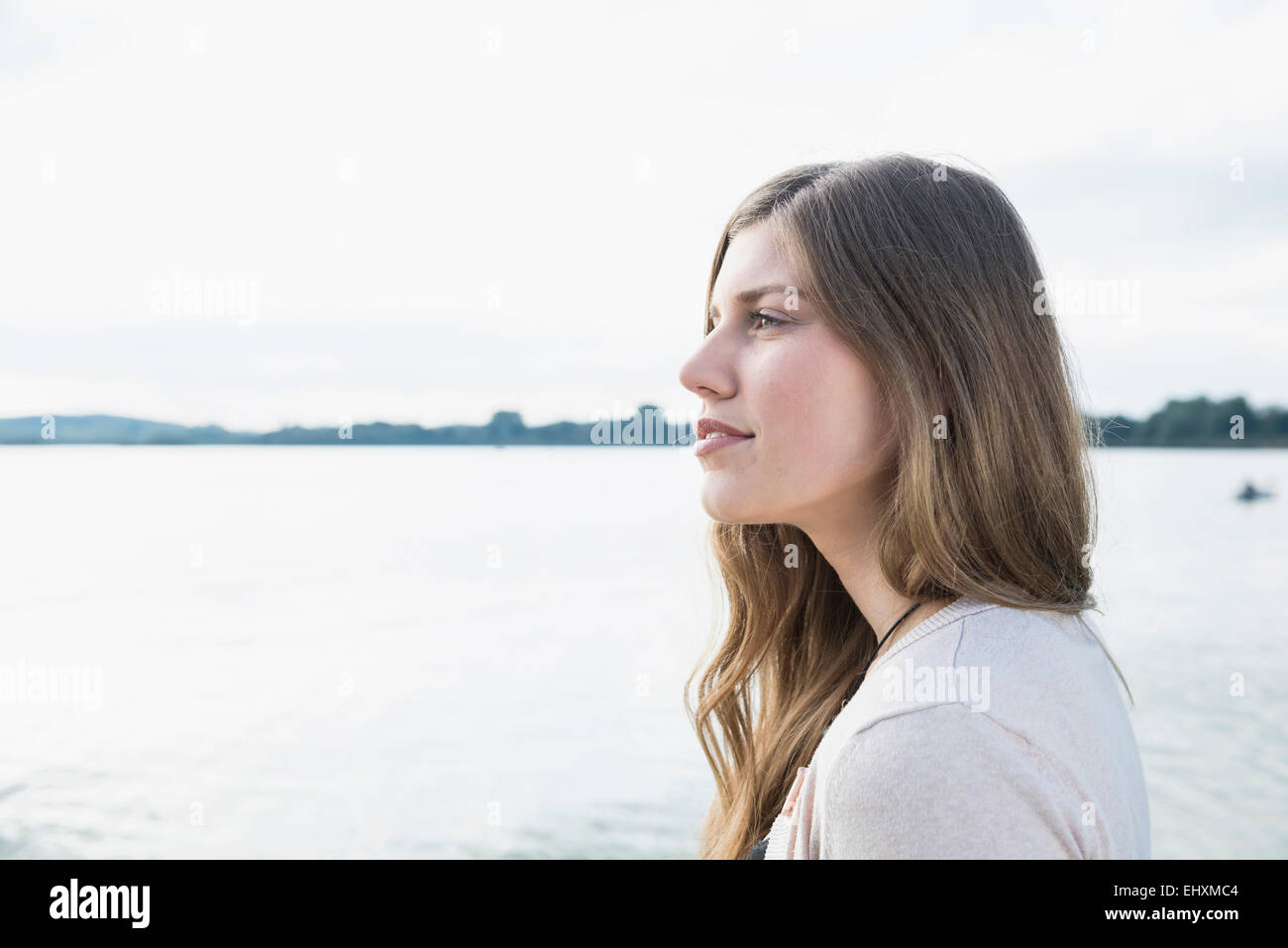 Attractive side profile portrait young woman Stock Photo - Alamy
