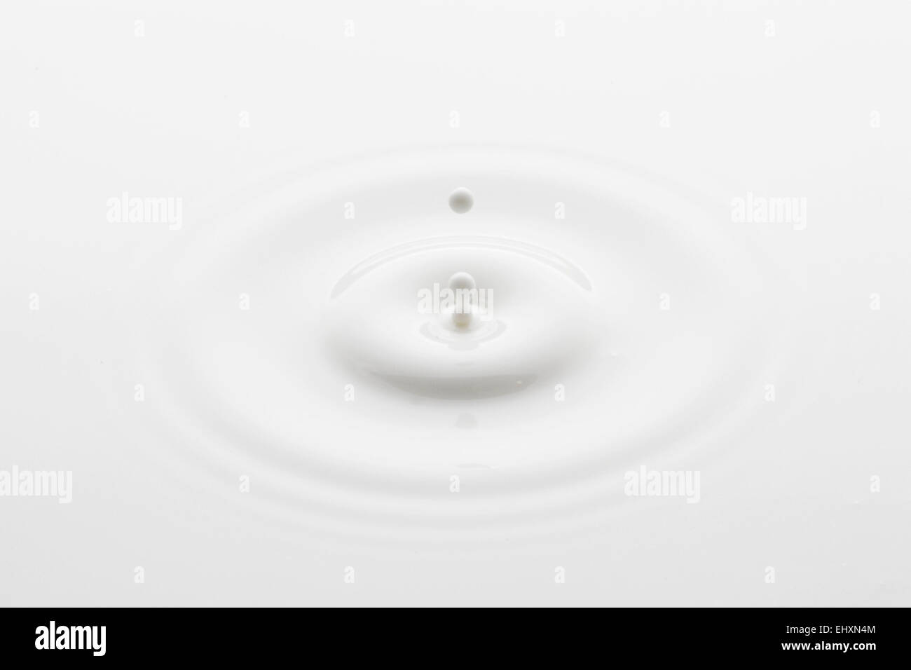 Close-up of a perfect minimalistic milk splash Stock Photo - Alamy