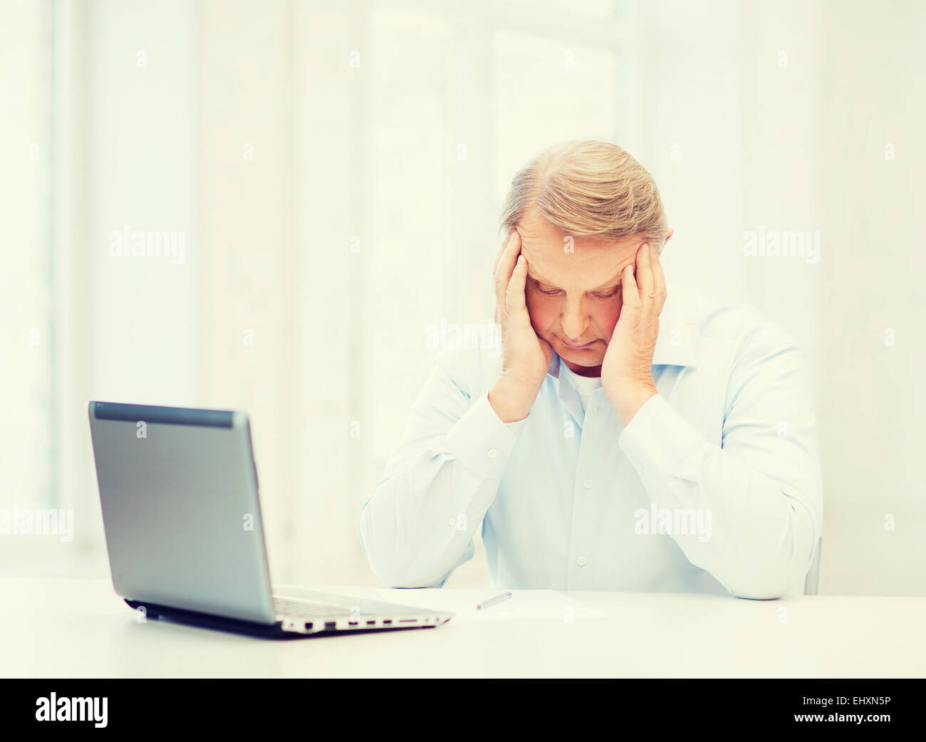 stressed old man filling a form at home Stock Photo - Alamy