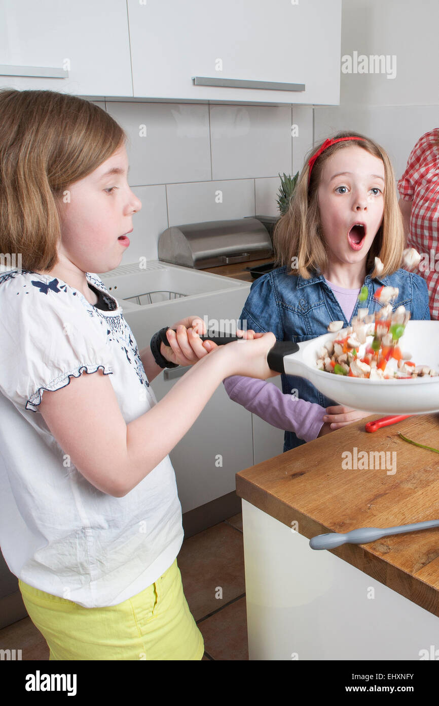Two sisters cooking together hi-res stock photography and images - Alamy