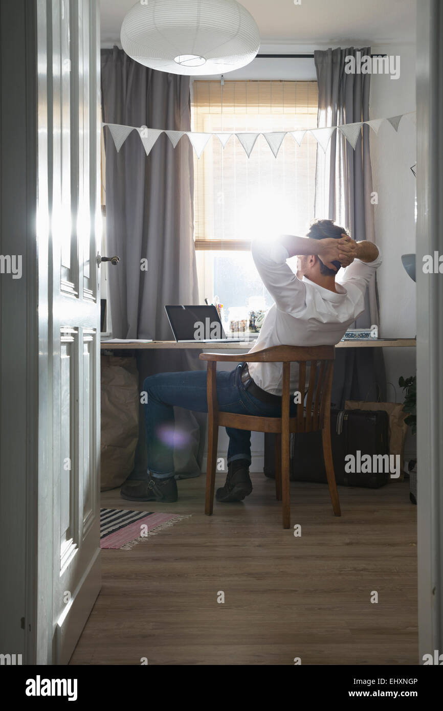 Man having a break at his home office Stock Photo - Alamy