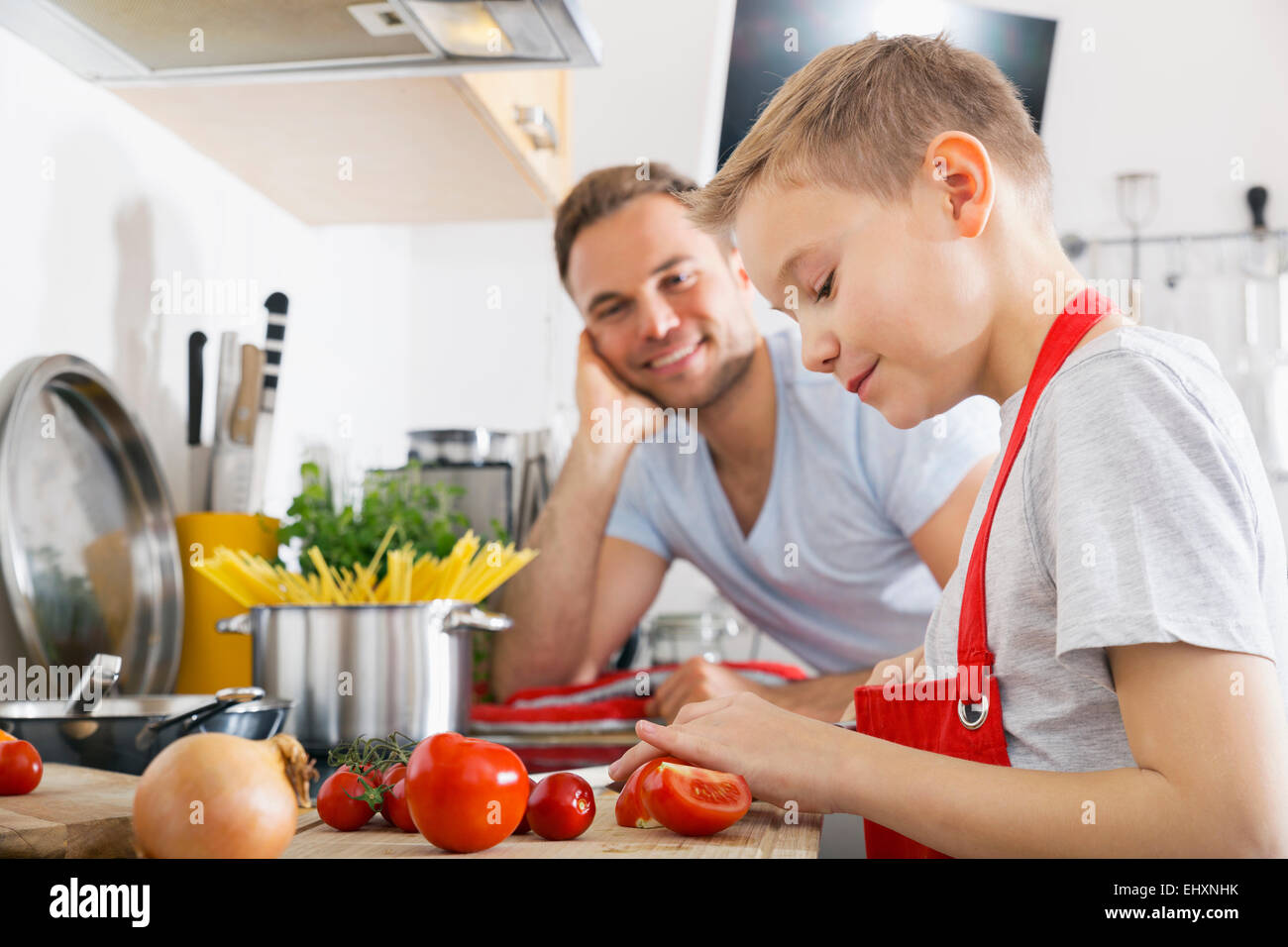 Father and son cooking together Stock Photo - Alamy