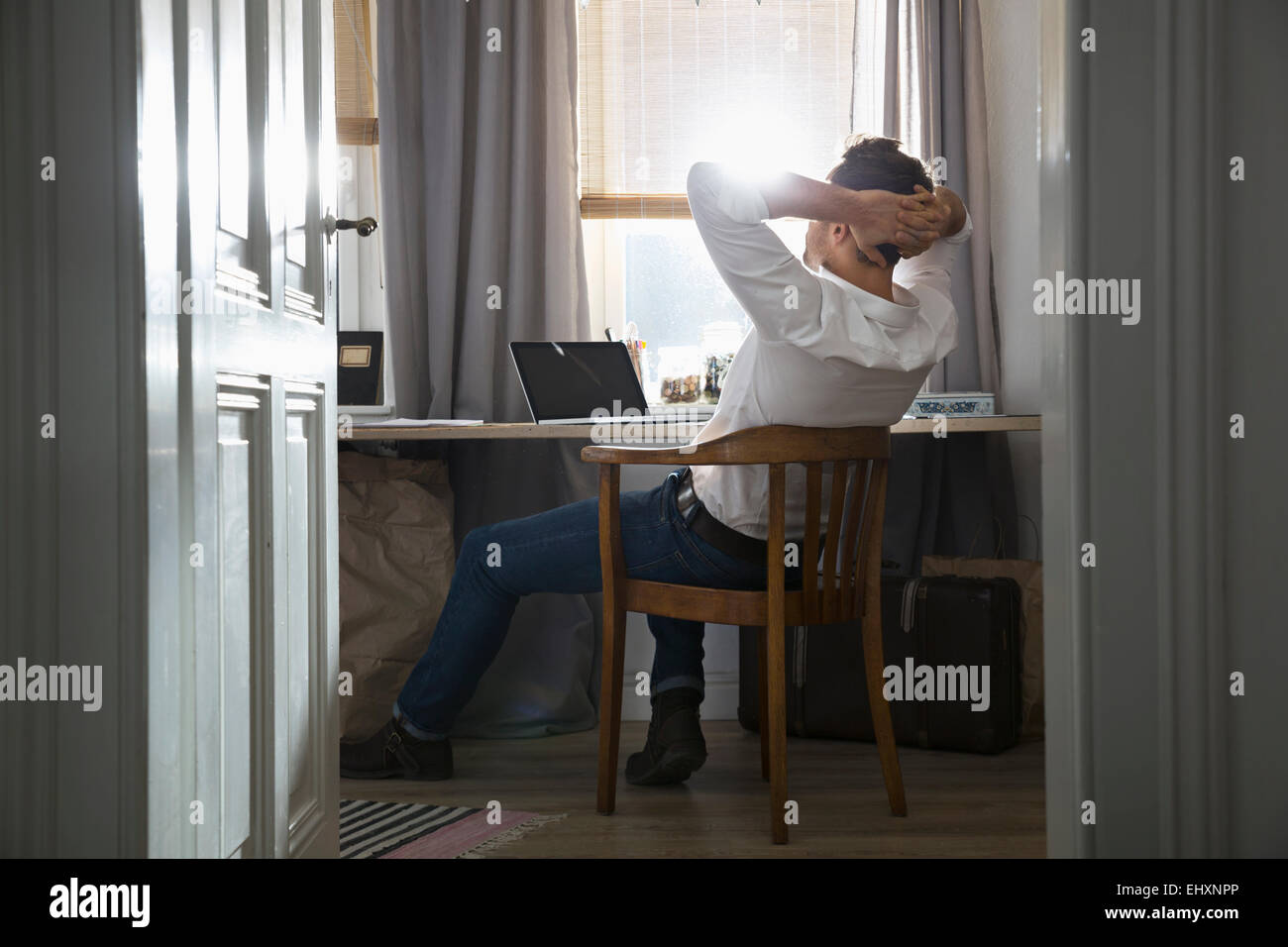 Man having a break at his home office Stock Photo - Alamy