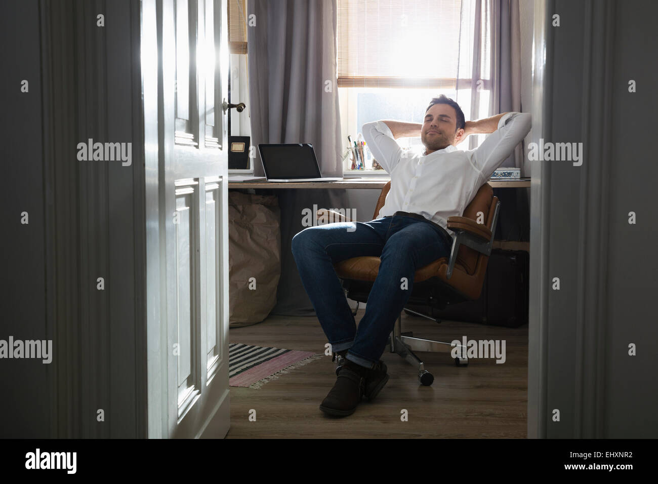 Man having a break at his home office Stock Photo - Alamy